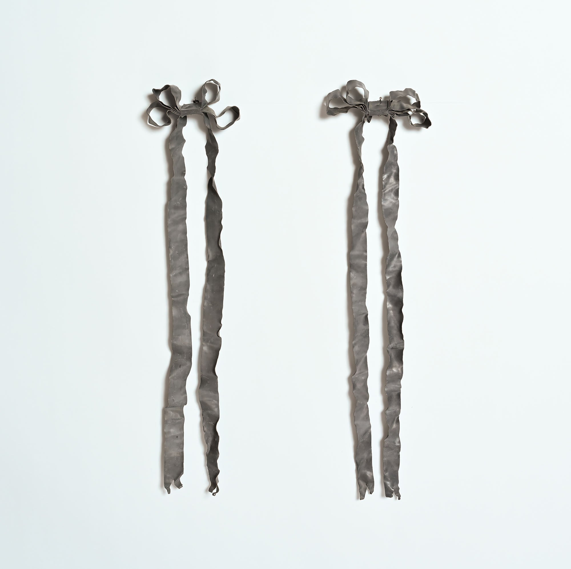 Pair of Lead Bow Ribbons